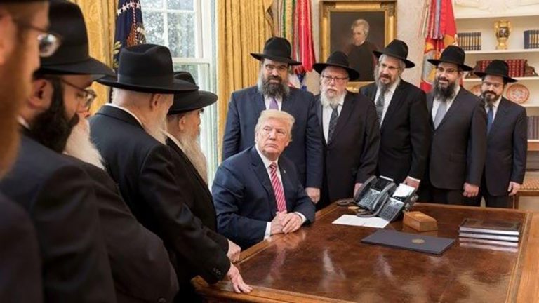 President Donald Trump with a group of Chabad rabbis in the Oval Office ...